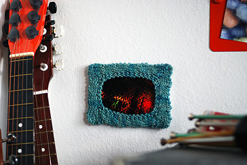 Ravelry: Cabled Frame pattern by Lee Meredith