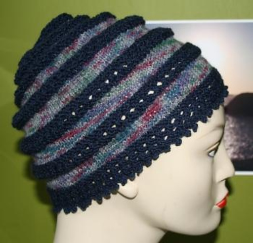 Ravelry: Squishy Eyelet Sock Yarn Hat pattern by Tess Young