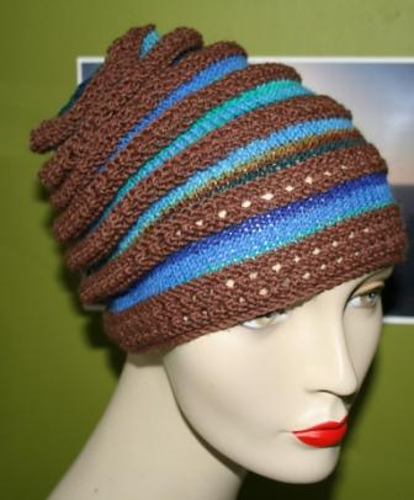 Ravelry: Squishy Eyelet Sock Yarn Hat pattern by Tess Young