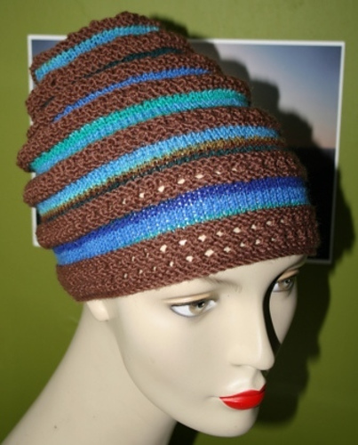 Ravelry: Squishy Eyelet Sock Yarn Hat pattern by Tess Young