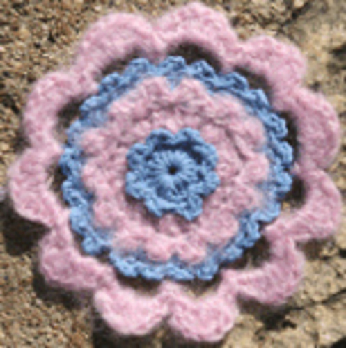 Ravelry: Frilly Target Flower pattern by Suzann Thompson