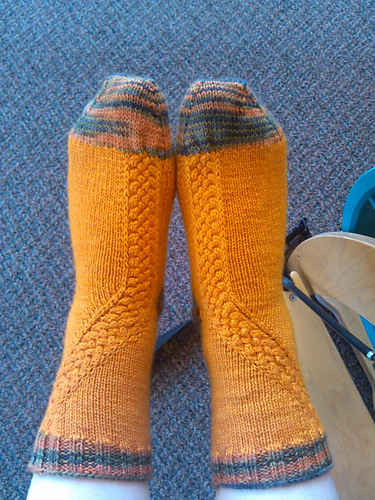 Ravelry: Cursed Cable Socks pattern by Mel-Tran Designs