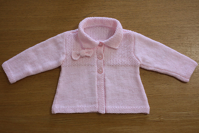 Ravelry: Moss Stitch Cardigan with Bow pattern by Sirdar