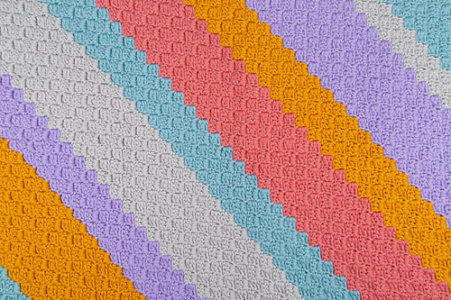 Ravelry: Tropical Stripes Blanket pattern by Kate Rowell