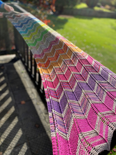 Ravelry: Chevron Twist Advent Wrap and Throw pattern by Fiona Wardingley