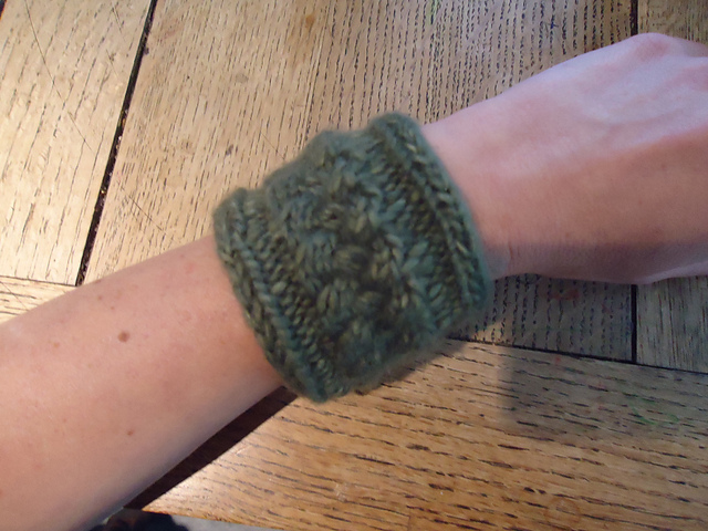Ravelry: Xena Cabled Wristband pattern by Harvey Nobum