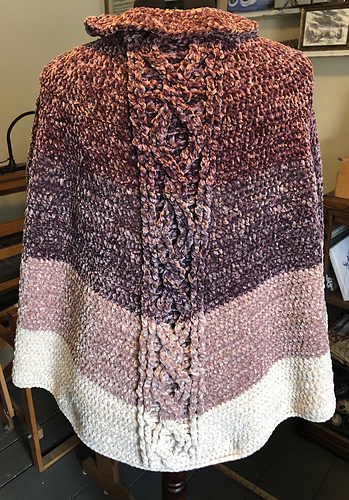 Ravelry: Hooded Cabled Cape pattern by Jessie Rayot