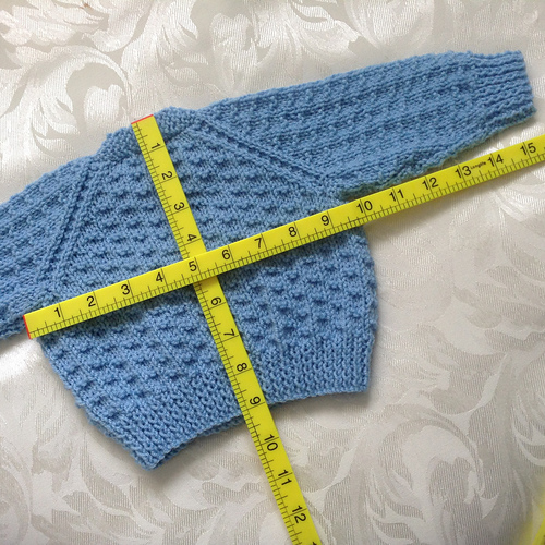 Ravelry: Crossover Baby Cardigan pattern by Jacqueline Gibb