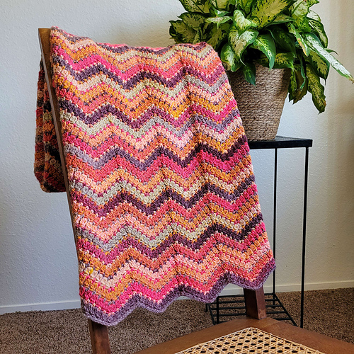 Ravelry: Huzzah Cluster Ripple Blanket pattern by Jennifer Olivarez