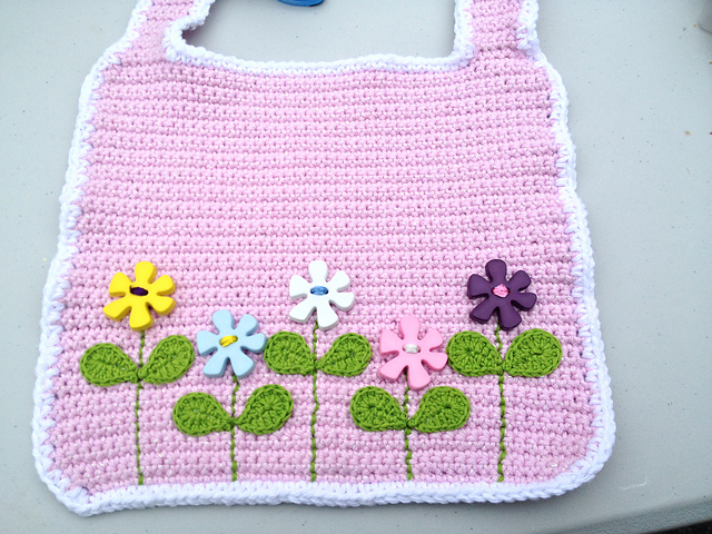 Ravelry: Toddler Flower Bib pattern by Lauren England