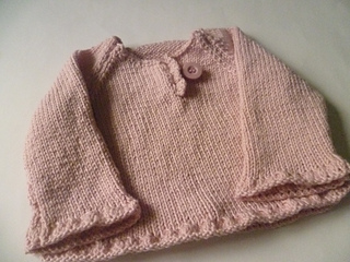 Ravelry: Baby Jumper with ruffles pattern by Caroline Ratcliffe