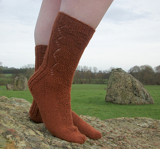 Ravelry: Carved Stone Ball Socks pattern by Sarah Foxley