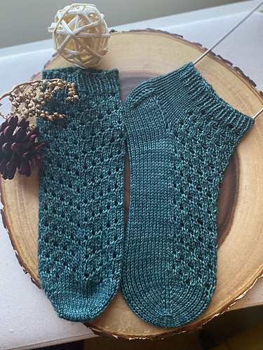 Ravelry: V Formation Socks DK pattern by Katie Herrod