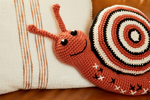 Ravelry: Sophie Snail Pillow pattern by Amy Gunderson