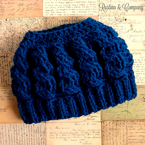 Ravelry: Cabled Messy Bun Beanie pattern by Rusti Jackson