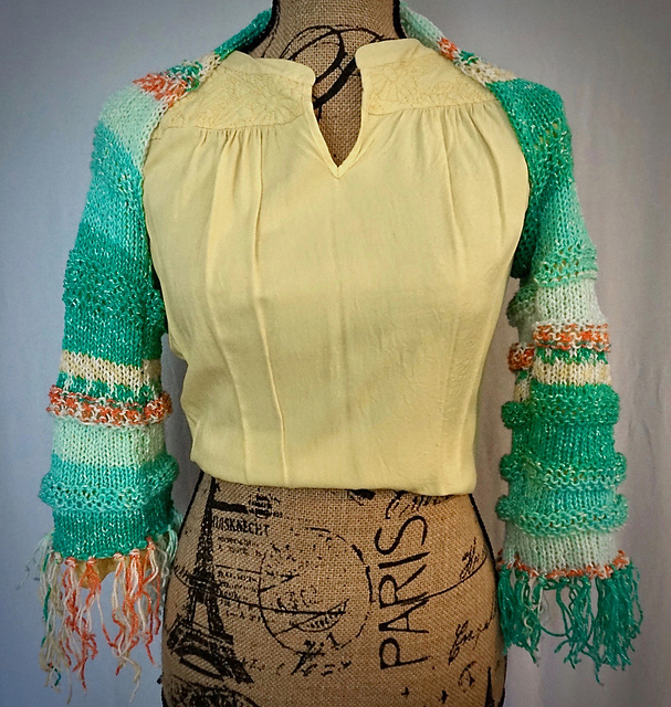 Ravelry: Minty Fringe Shrug pattern by Loom Knit Designs with BOHLD
