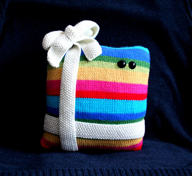 Ravelry: Big friendly Christmas present mini-cushion pattern by ...