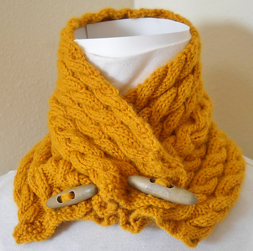 Ravelry: Cable Knit Button Cowl pattern by Crystal Lybrink