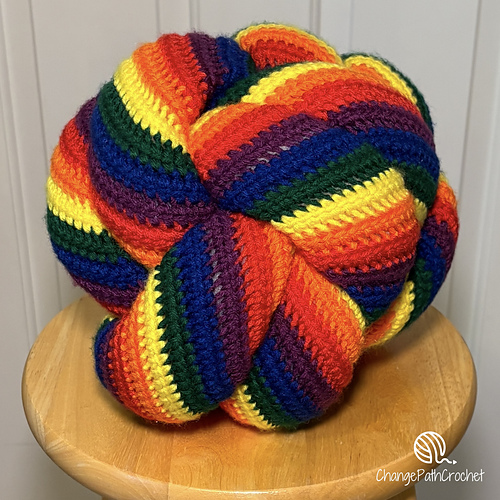 Ravelry: Striped Knot Pillow pattern by Heather Stagl