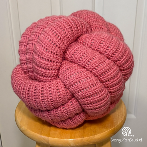 Ravelry: Striped Knot Pillow pattern by Heather Stagl