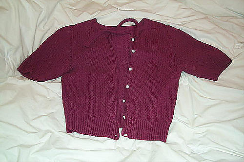 Ravelry: Short-Sleeved Cardigan with Bow pattern by Sarah Dallas