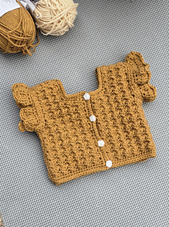 Ravelry: Toasted Marshmallow Baby Top pattern by Susanna Biaye