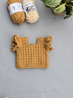 Ravelry: Toasted Marshmallow Baby Top pattern by Susanna Biaye