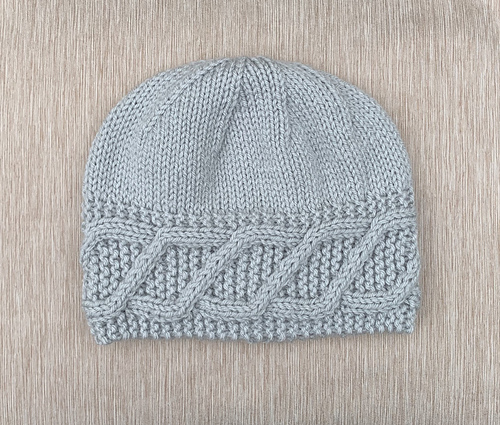 Ravelry: Hat with a Diagonal Cable on the Border pattern by Yelena Chen