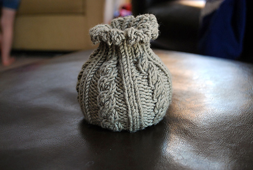 Ravelry: Cabled Yarn Cake Cozy pattern by Heather Long