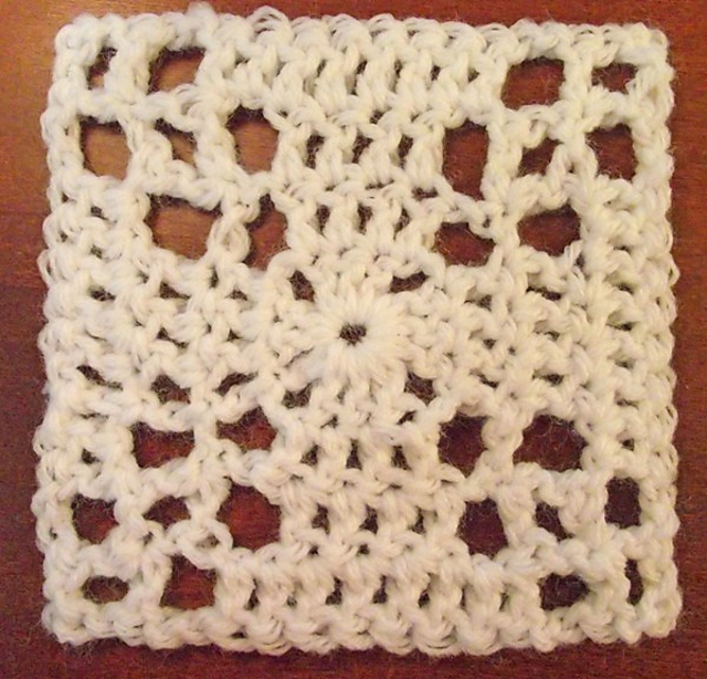 Ravelry: Corner Eyelet Lace Granny Square pattern by Julia Tellier