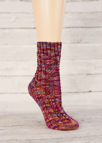 Ravelry: Colorplay Cabled Sock pattern by Shannon Okey
