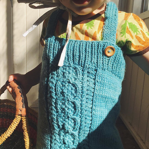 Ravelry: Cabled Romper pattern by Abby Belnap
