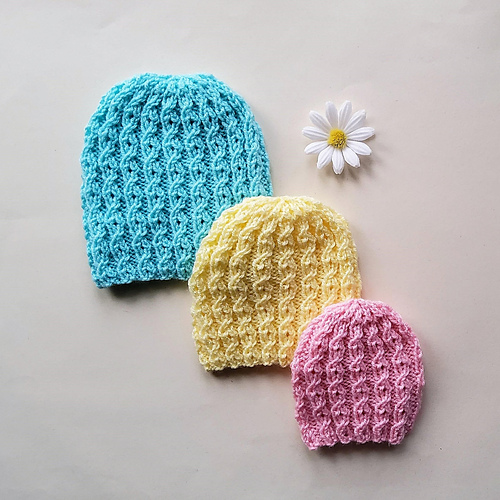Ravelry: Lacy Faux Cable Baby Hats pattern by marianna mel